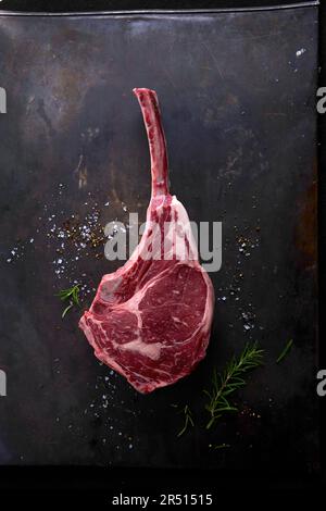 Raw tomahawk steak Stock Photo - Alamy