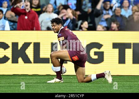 Selwyn Cobbo of the Maroons celebrates his try with Reece Walsh and ...