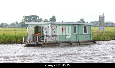 Houseboat on the move in the Netherlands, canal Stock Photo - Alamy