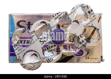 Packet of Strepsils extra triple action blackcurrant lozenges pain ...