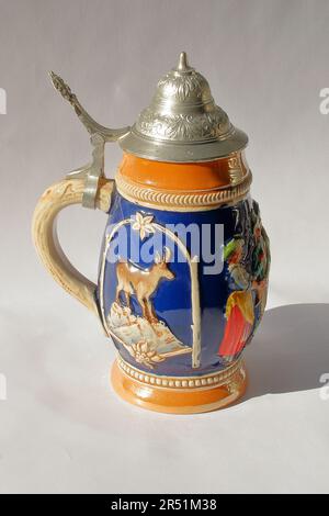 The photograph beautifully decorated traditional German mug for beer ...