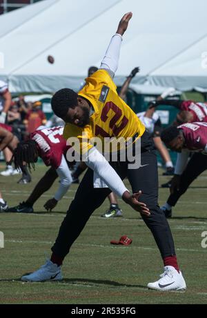Washington Commanders quarterback Jacoby Brissett stretches during the ...