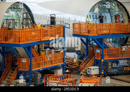 Boeing employees assemble 787s inside their main assembly building on ...