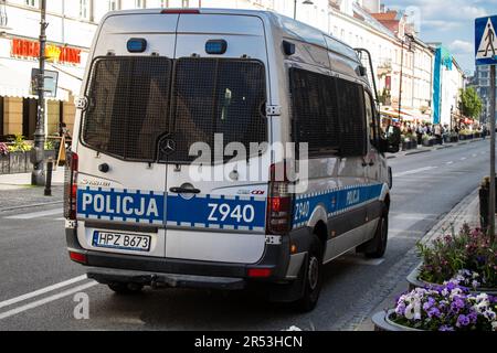 Warsaw, Poland - May 28, 2023 Police car driving in the city center of ...