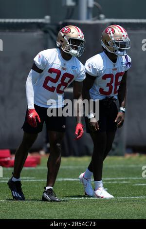 San Francisco 49ers' Avery Young, left, and Isaiah Oliver take part in ...