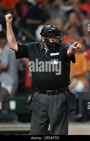 Home plate umpire Jerry Layne (24) calls a strike in the top of the ...