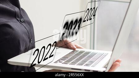 button 2023, 2024 numbers on virtual screen Stock Photo - Alamy