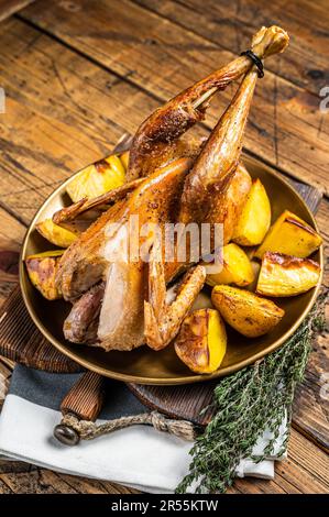 Roasted guinea fowl with herbs and potato, cooked farm eco bird ...
