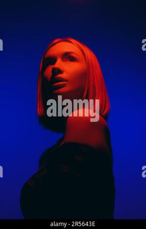 Photo of charming lady short hairdo hold netbook finger chin look ...