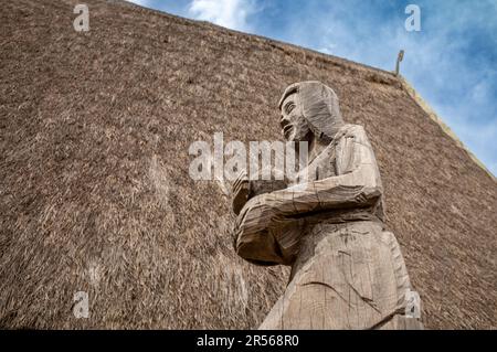A traditional "nha rong", or cultural house, with its soaring sail-like ...