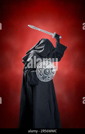 Dark knight with sword over dark red misty background Stock Photo - Alamy