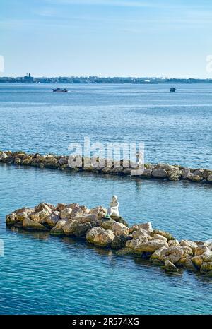 Italy, Puglia region, Taranto, seafront. Cliff with mermaid sculpture ...