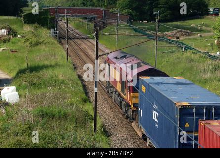 Class 66 diesel-electric shed locomotive on container train on West ...