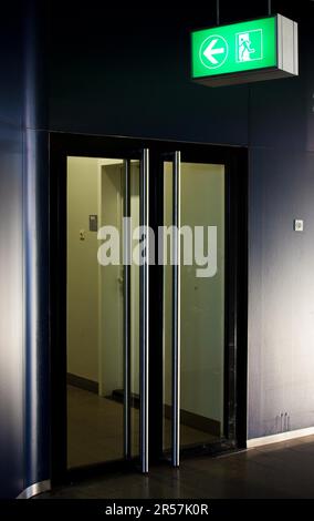 Emergency exit sign in modern offices inside an industrial plant Stock ...