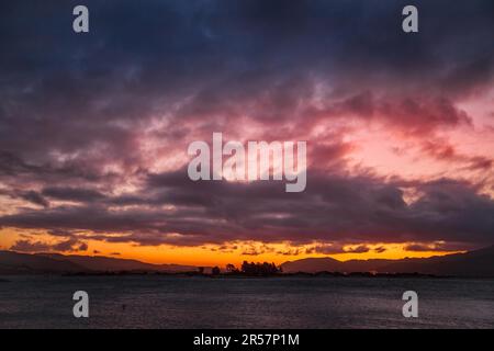 Sunset over Pilot Bay in New Zealand Stock Photo - Alamy