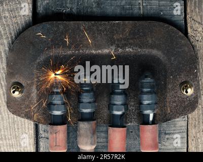 First Advent background with four spark plugs on rusty sign, car ...