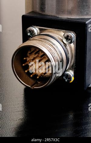 Metal encoder on a black wooden table, top view Stock Photo - Alamy
