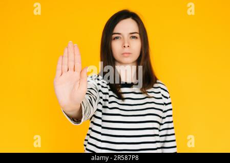Determined Woman Making Stand: Serious Lady with Confident Expression ...