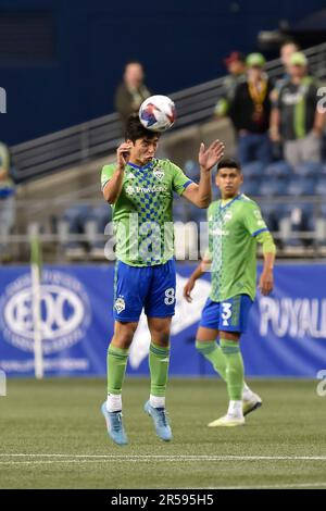 Seattle Sounders midfielder Josh Atencio (8) is defended by Los Angeles ...