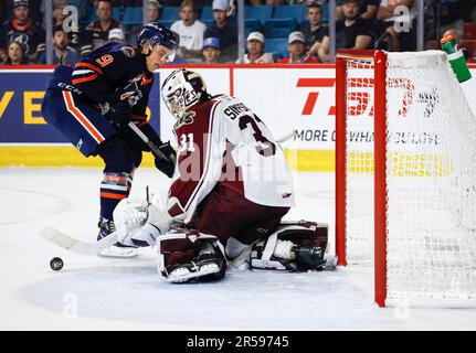 Peterborough Petes goalie Michael Simpson, center, stops a shot from ...