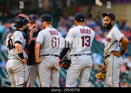 Cleveland Guardians pitching coach Carl Willis, left, talks with relief ...