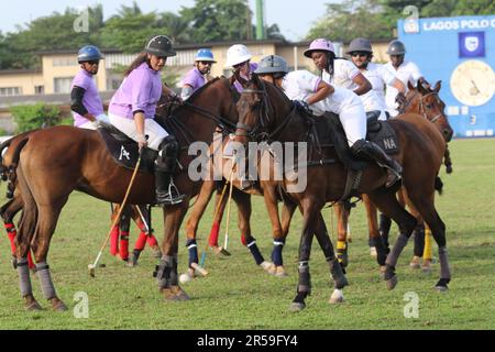 Polo players compete for the ball during the Ladies Polo invitation ...