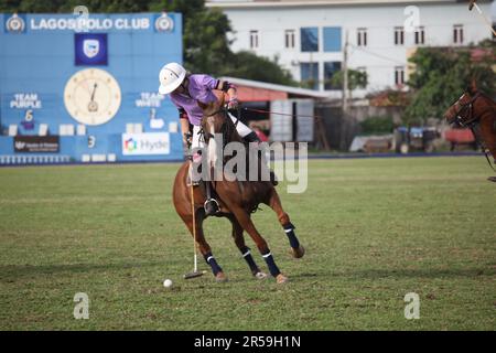 Polo players compete for the ball during the Ladies Polo invitation ...
