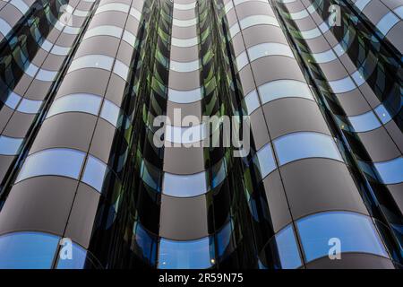 Wave formed glass facade of an office building Stock Photo - Alamy