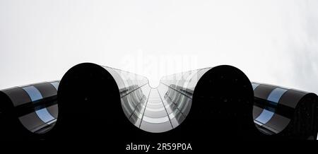 Wave formed glass facade of an office building Stock Photo - Alamy