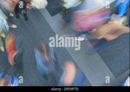 People moving around the floor of a book fair Stock Photo - Alamy