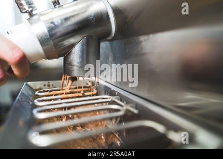 Pouring ice cream formula from pasteurizer. High quality photo Stock ...