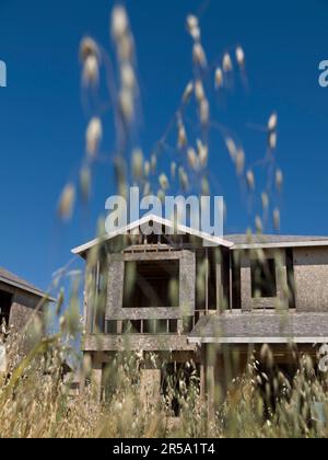 Structures in a failed and abandoned housing development Stock Photo ...
