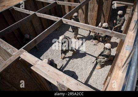 Soldiers in basic training move tactically as a squad during close ...