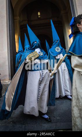 Blue capirote procession during the holy week in Grenada, Spain ...