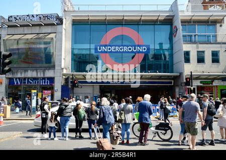 brixton underground station; SW9 market with stalls shops restaurants ...