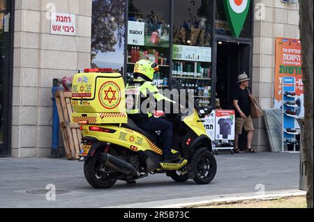 A paramedic of Magen David Adom emergency service hugs an Israeli ...