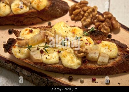 Baguette with brie and pears, rye baguette, soft cheese, gratinated ...
