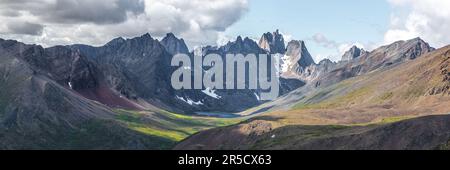 Hiker in beautiful mountains in Tombstone Territorial Park, Yukon ...