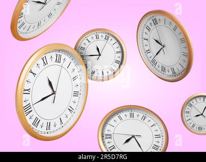 Many stylish clocks falling on light blue background Stock Photo - Alamy