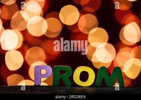 Word PROM on dark table against blurred lights Stock Photo - Alamy