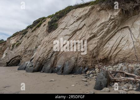 Natural oil seep at the bottom of the coastal cliff in Goleta, Southern ...