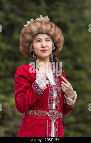 Traditional dress. Woman in Ala-Archa National Park. Kyrgyzstan Stock Photo - Alamy