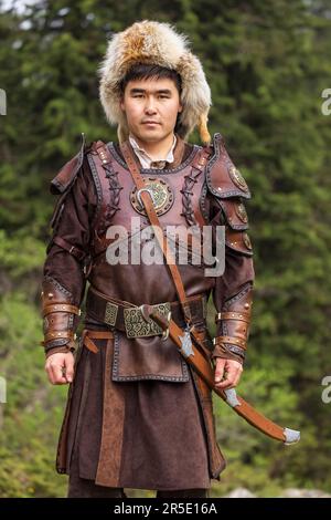 Traditional suit. Man in Ala-Archa National Park. Kyrgyzstan Stock Photo - Alamy