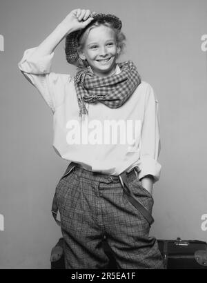 Travel with old suitcase. Homelss. old fashioned child in beret eat ...