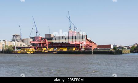 River Thames & Cory waste management company tug towing barges down ...
