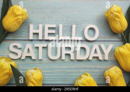 Hello Saturday alphabet letters with flower frame on purple background ...