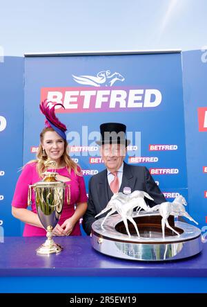Katrina Helmer and Betfred owner Fred Done pose with the Kentucky Derby ...