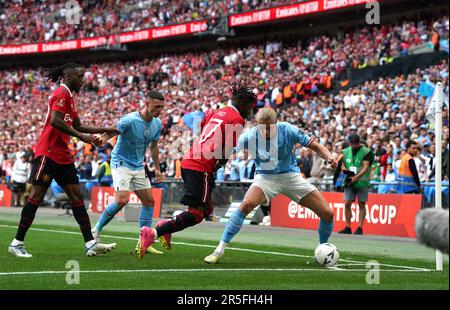 Manchester City's Erling Haaland (right) and Kalvin Phillips react ...