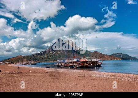 Boats. the beach, and Mountain of Moses (Musa Dağı) at Adrasan on the ...