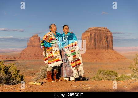 American Indian Navajo couple posing during sunset at Monument Valley ...